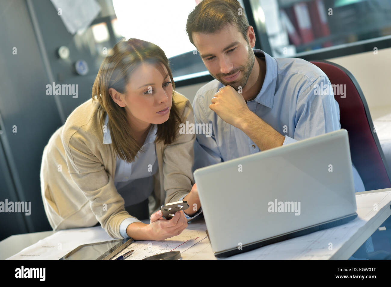 Engineers in industrial sector working in office Stock Photo - Alamy