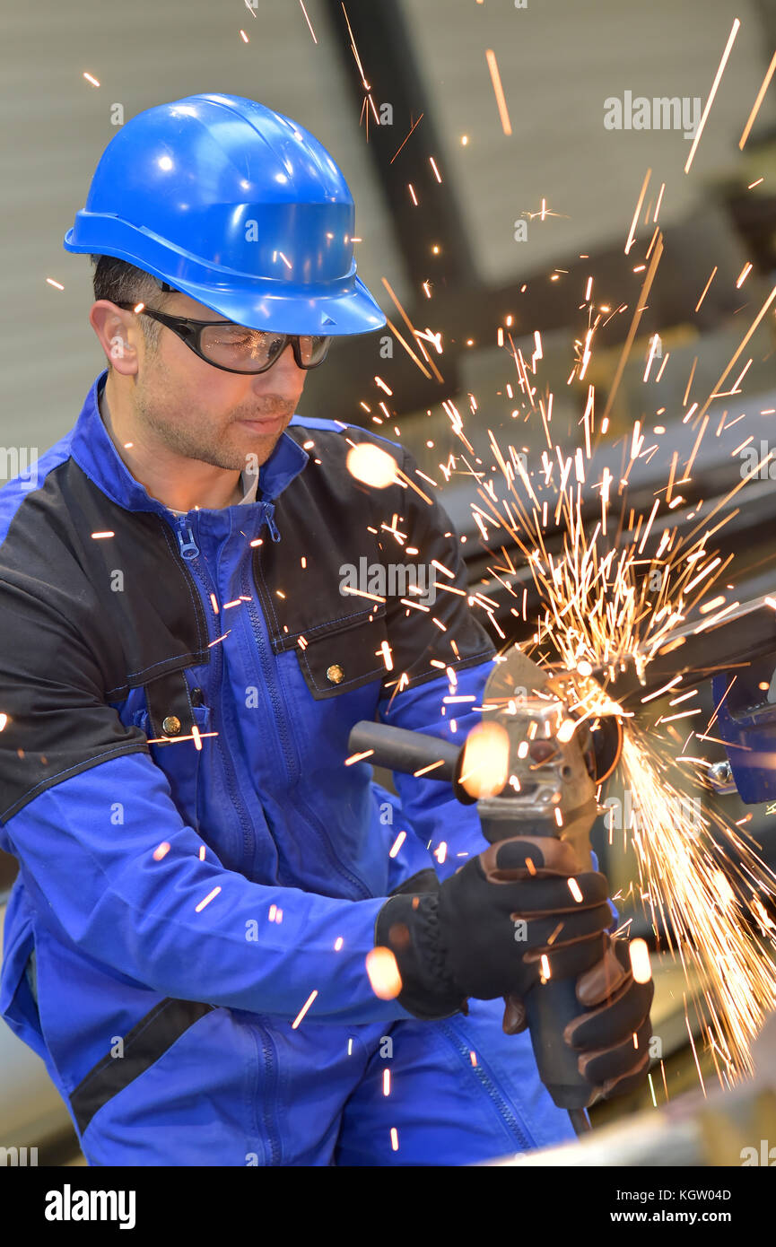 Man in workshop manufacturing metal Stock Photo - Alamy