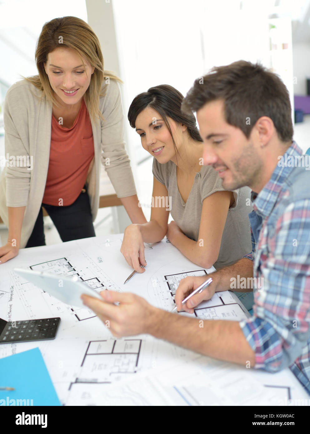 Workteam of architects meeting in office Stock Photo - Alamy