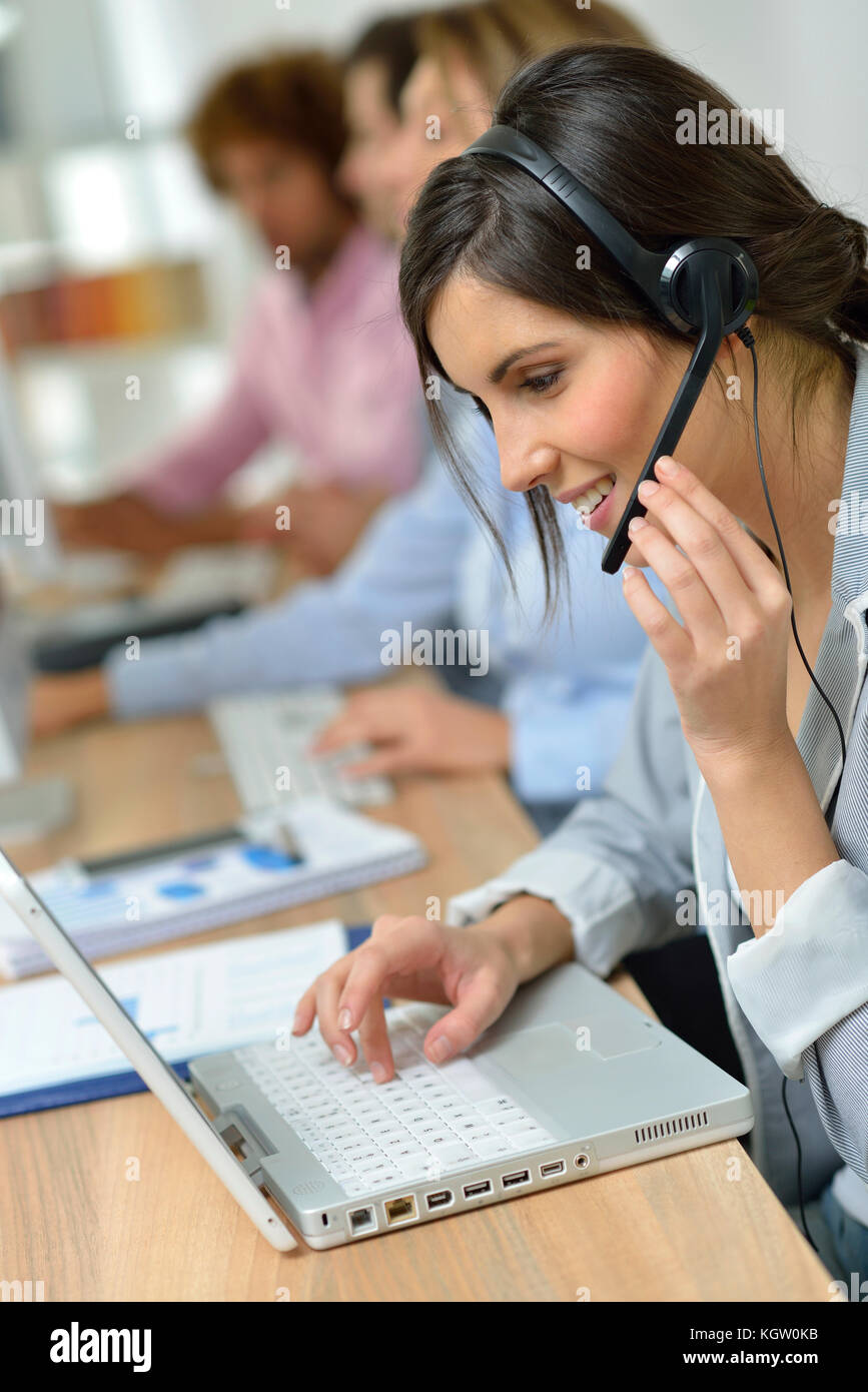 Beautiful smiling customer service representative Stock Photo - Alamy