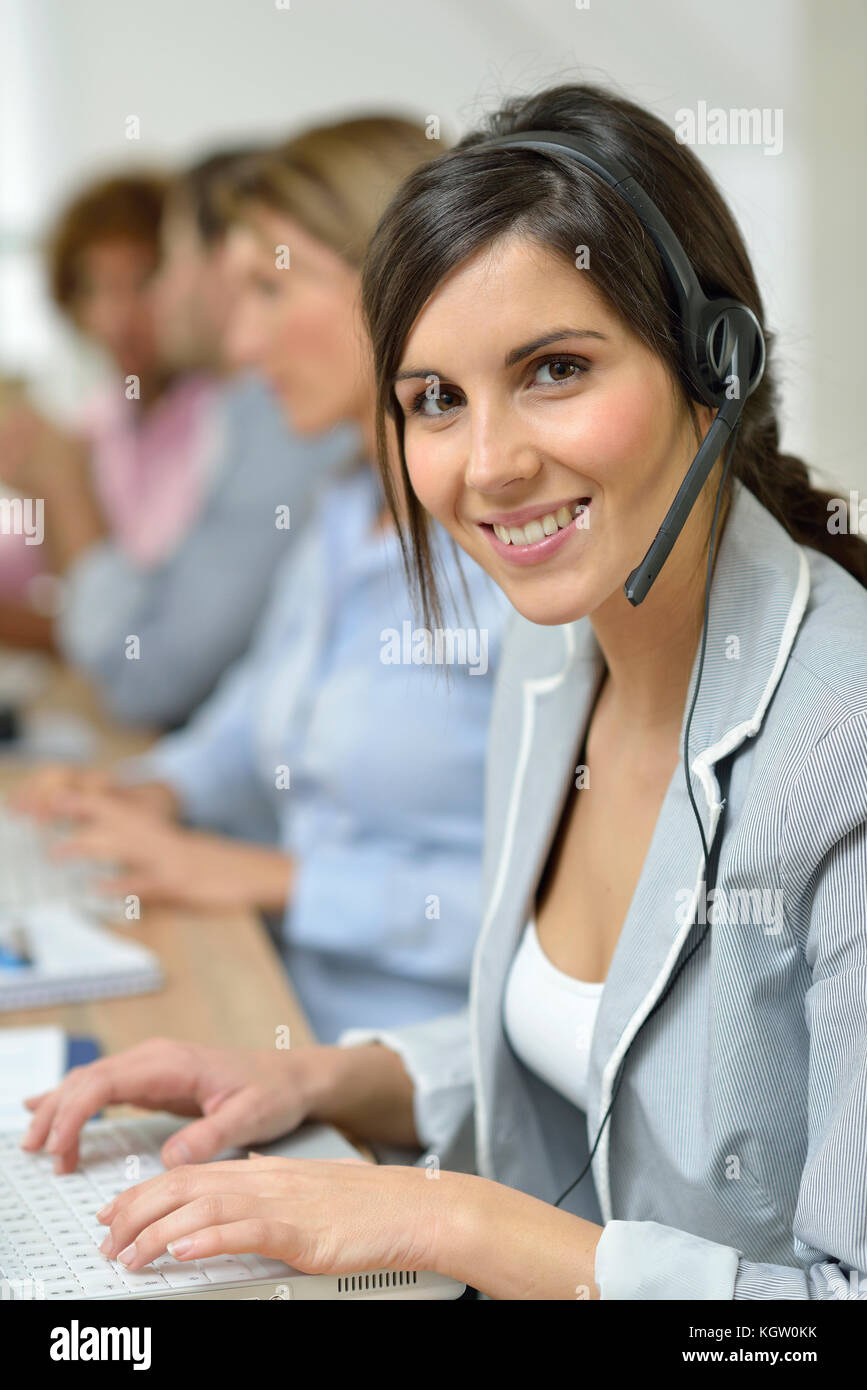 Beautiful smiling customer service representative Stock Photo - Alamy
