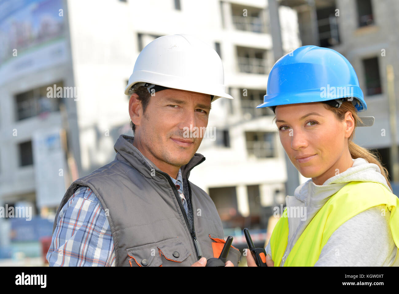 Construction team on building site Stock Photo - Alamy