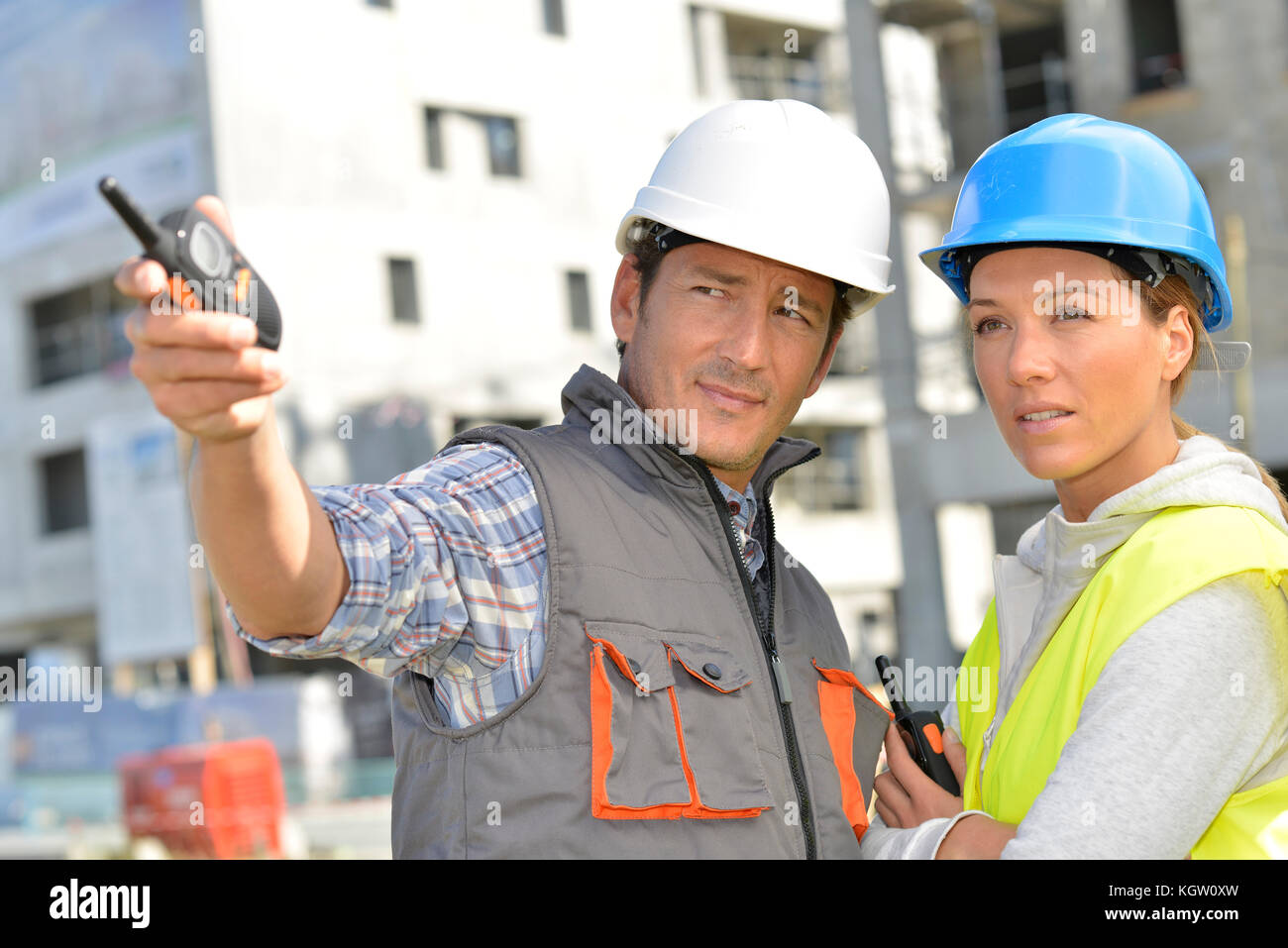 Construction team on building site Stock Photo - Alamy