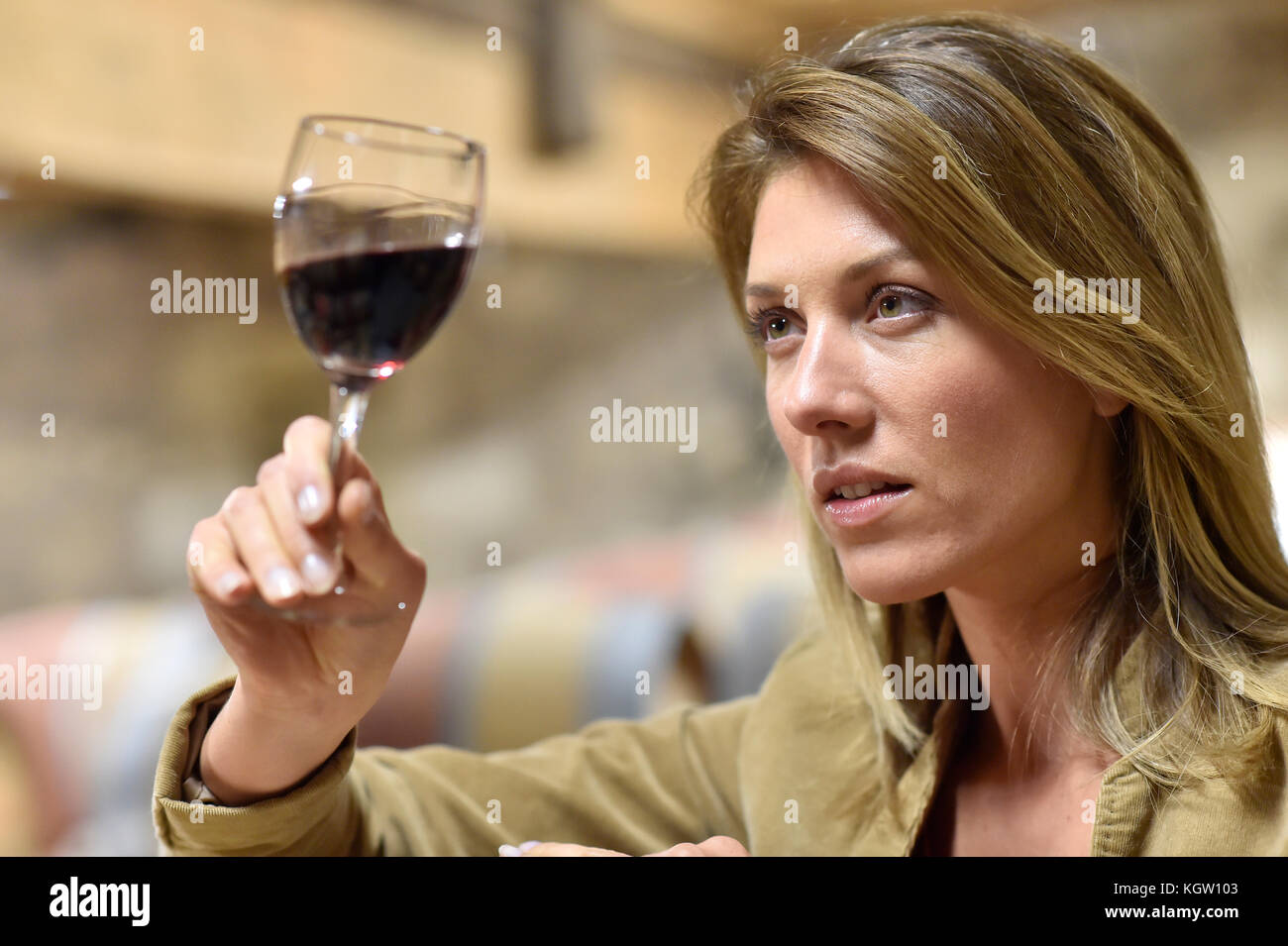 Woman tasting red wine in cellar Stock Photo - Alamy