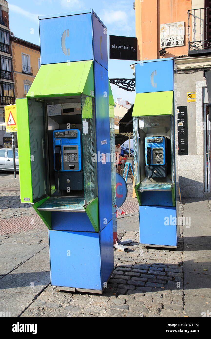 Telephone kiosk boxes in street, La Latina, Madrid city centre, Spain ...