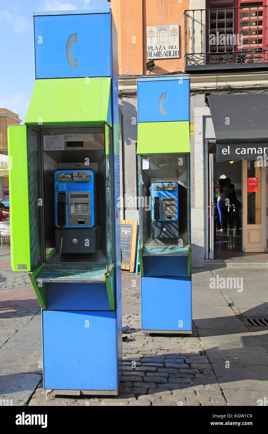 Telephone kiosk boxes in street, La Latina, Madrid city centre, Spain ...