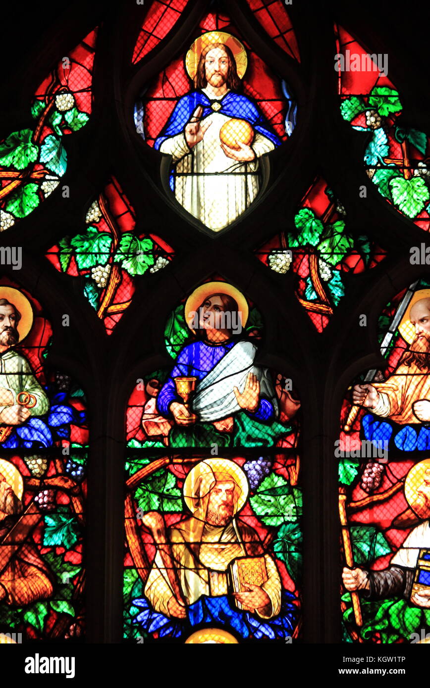Stained glass window with a Jesus, saints and angels Stock Photo - Alamy