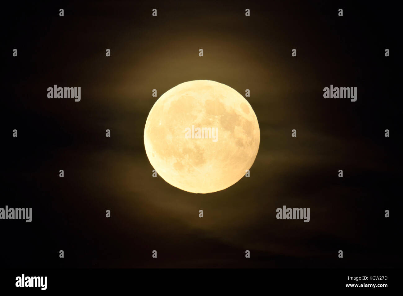 Full moon / Vollmond shining bright in dark night, amber moon with some ...