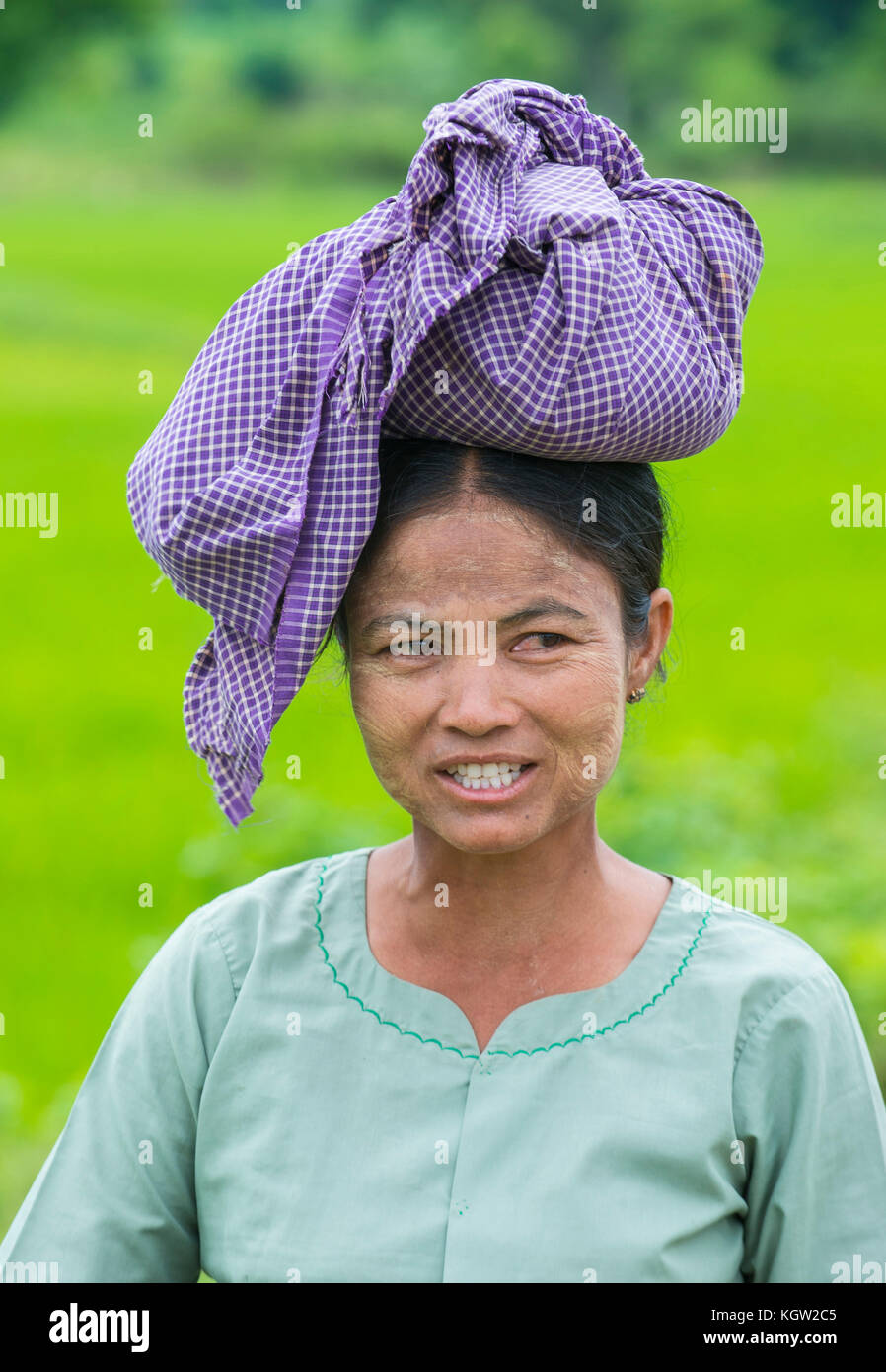 Portrait of Burmese farmer working at a rice field in Shan state ...