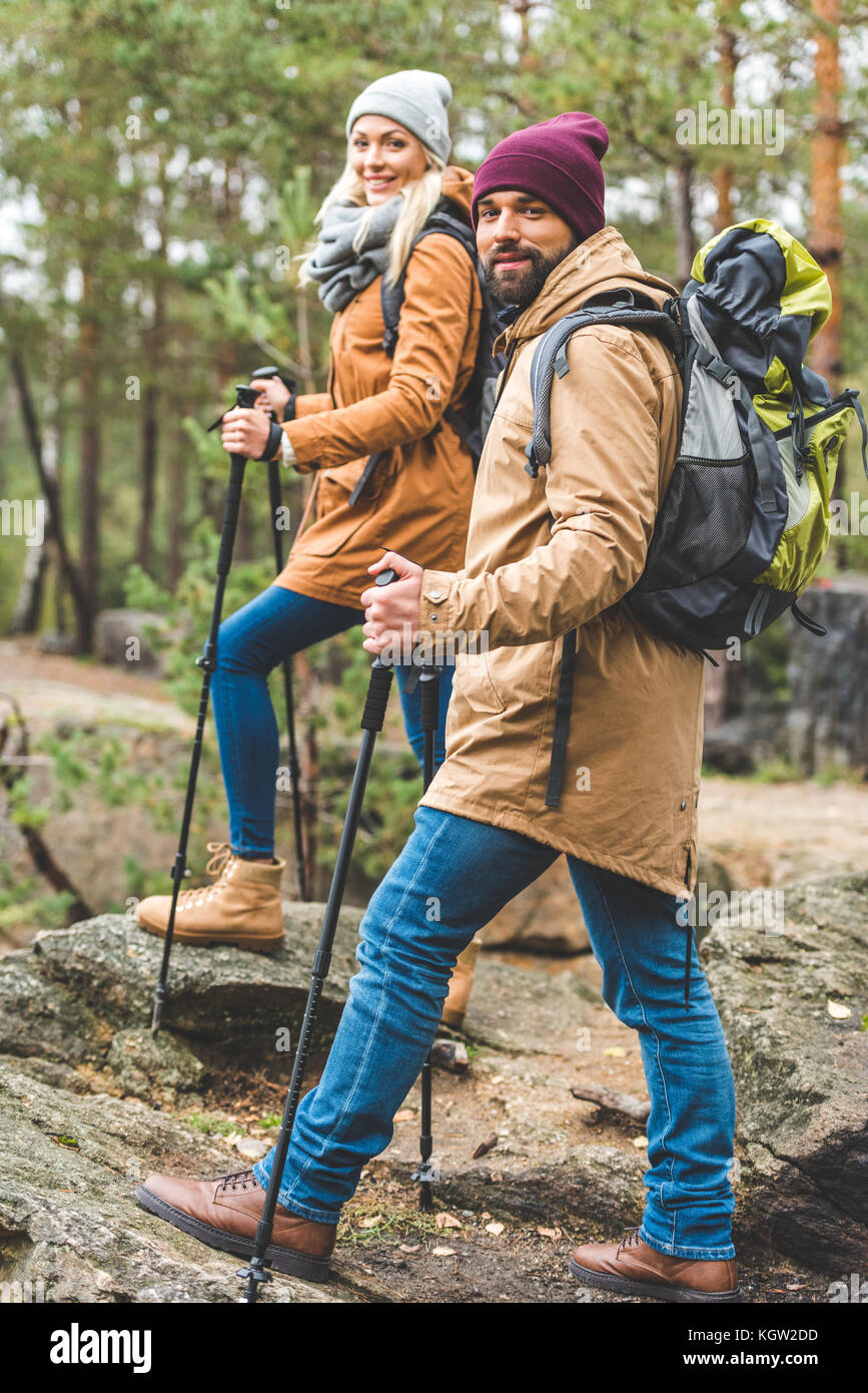 couple trekking in forest Stock Photo - Alamy