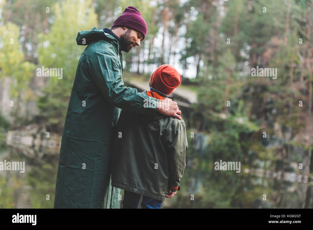 father and son in autumn forest Stock Photo - Alamy