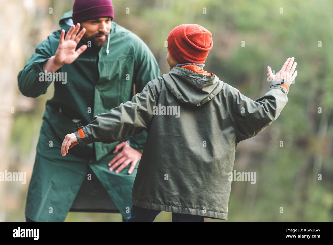 family giving high five Stock Photo - Alamy
