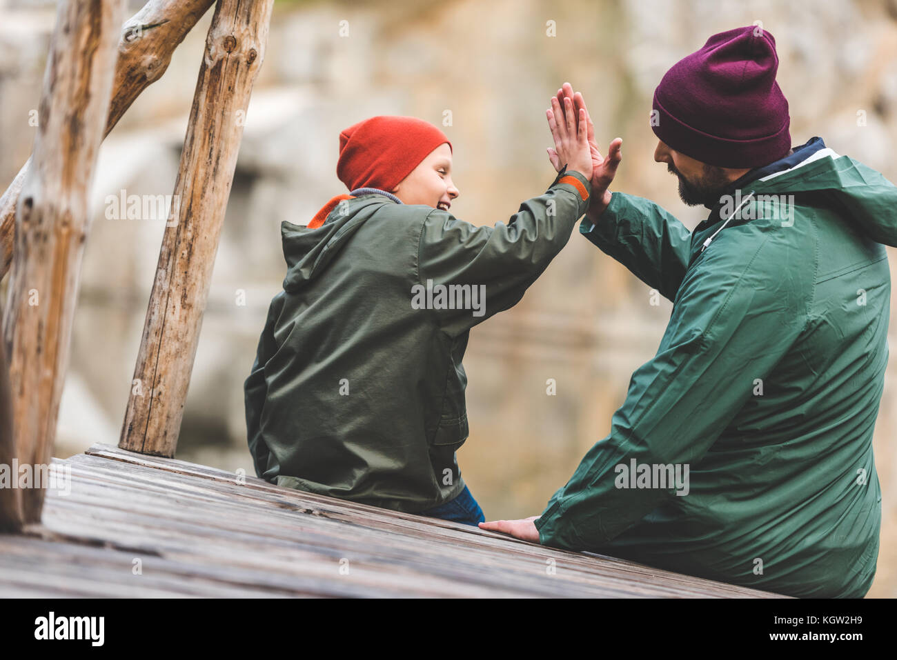 family giving high five Stock Photo - Alamy