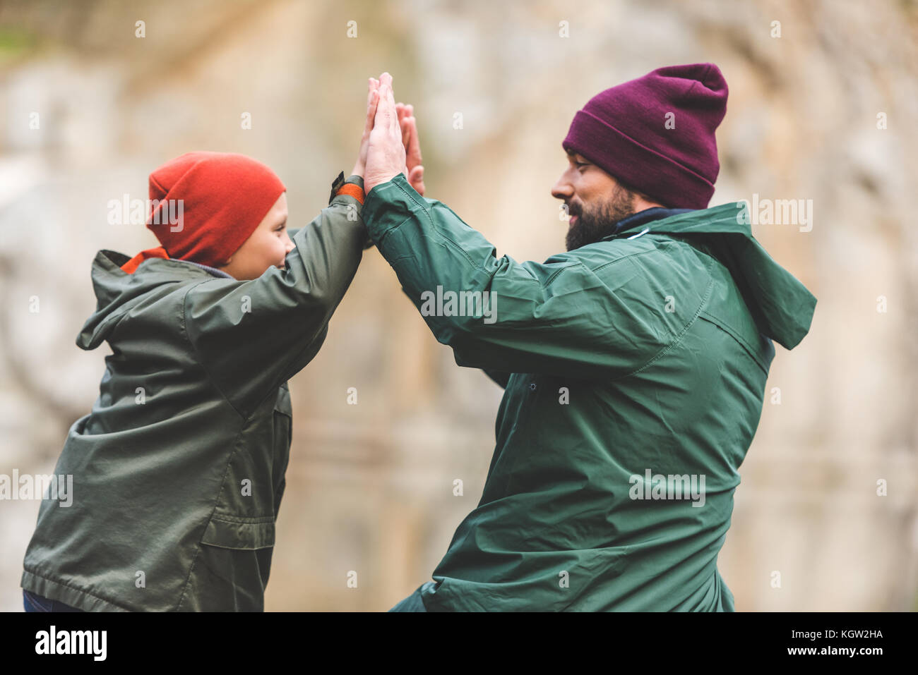 family giving high five Stock Photo - Alamy