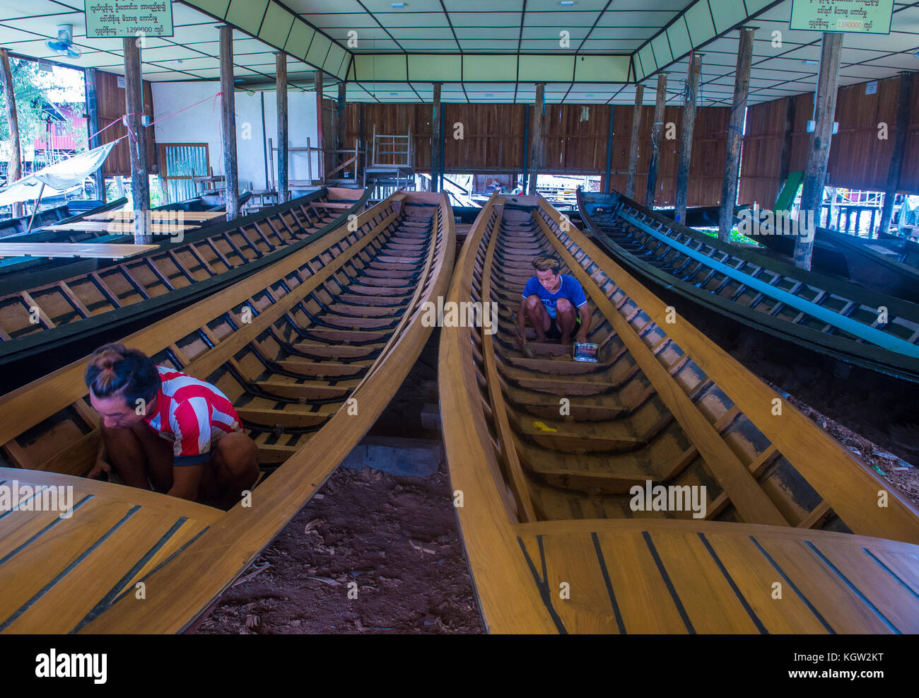 Burmese man building a boat in Inle lake Myanmar Stock Photo - Alamy