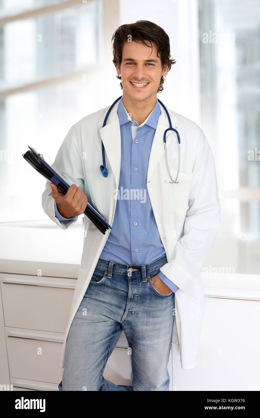 Cheerful student in medicine standing in hospital hallway Stock Photo ...