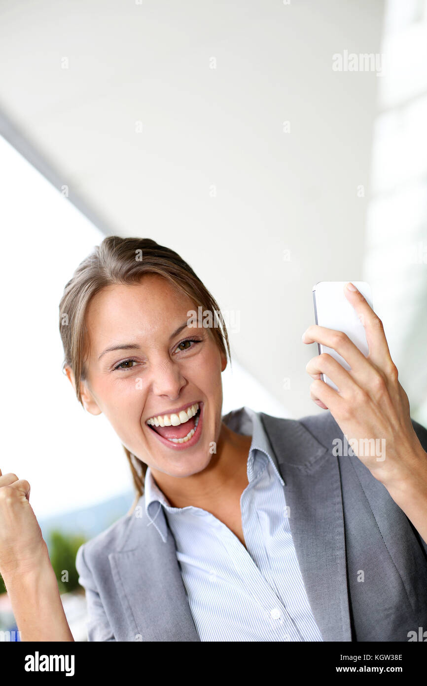 Successful businesswoman with happy look Stock Photo - Alamy
