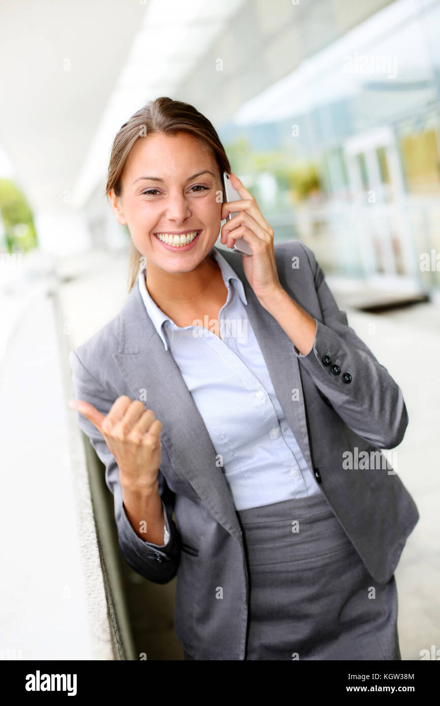 Successful businesswoman with happy look Stock Photo - Alamy