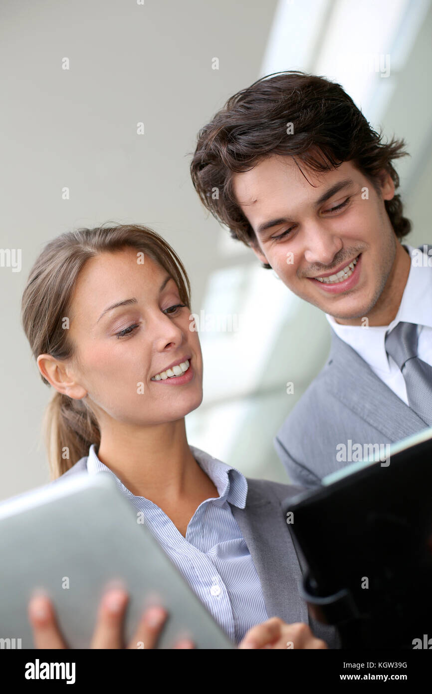 Business partners meeting outside building Stock Photo - Alamy
