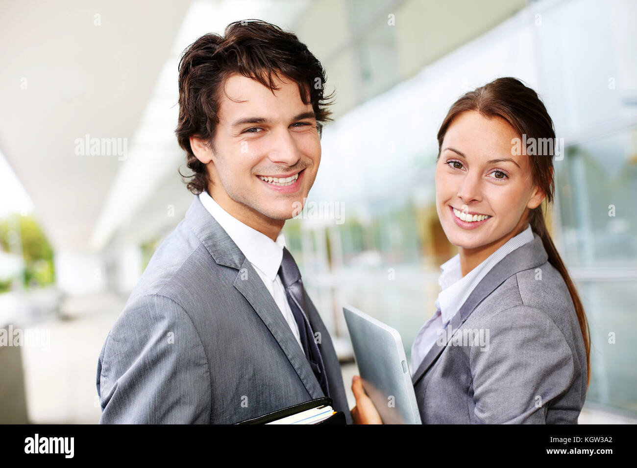Successful business team standing outside Stock Photo - Alamy