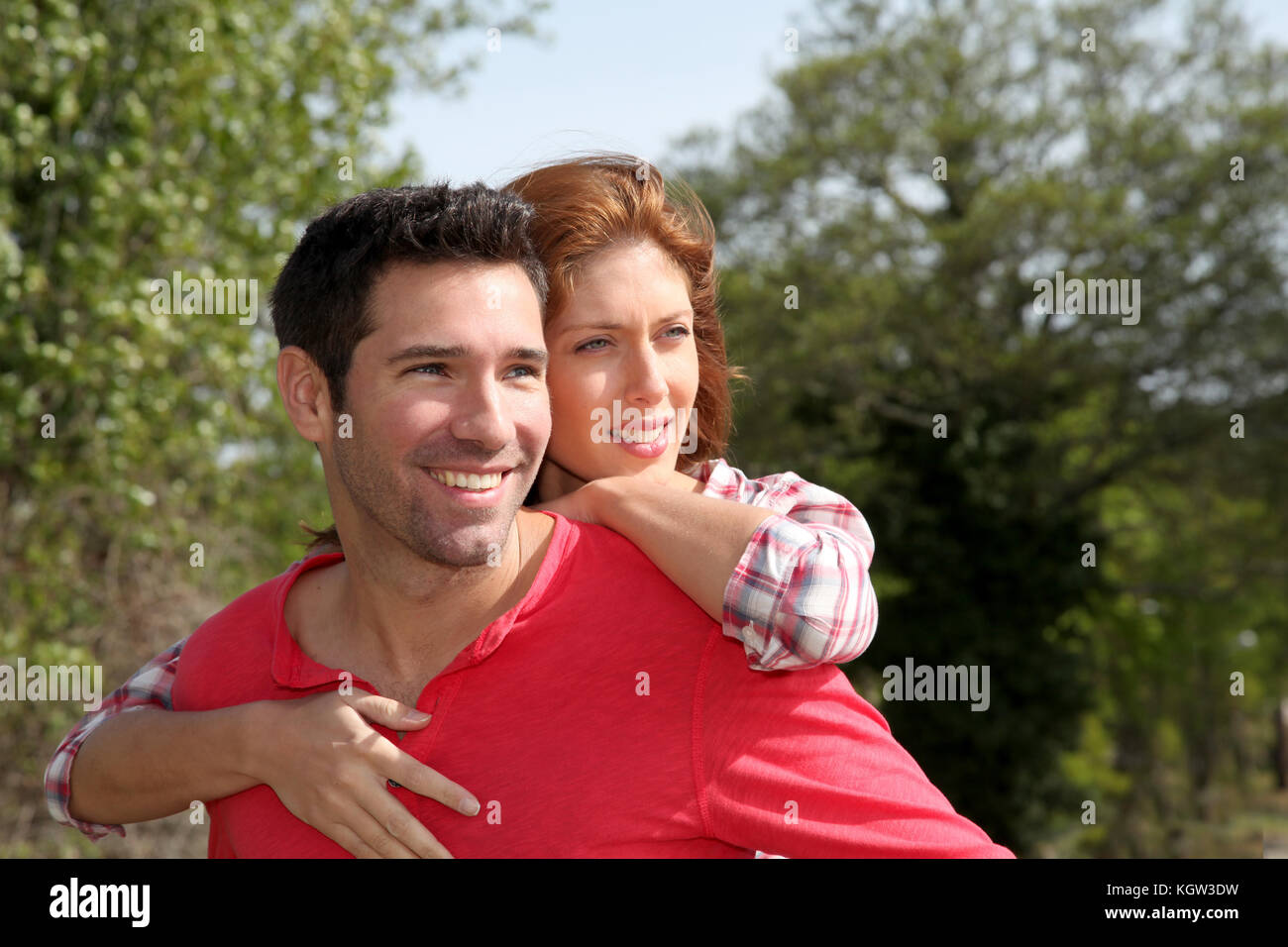 Man holding girlfriend on his back Stock Photo - Alamy
