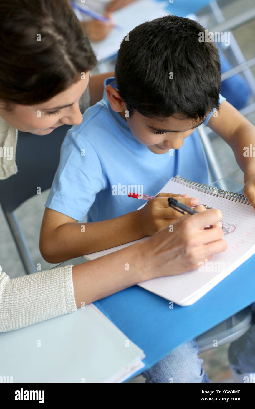 Preschool teacher helping year old hi-res stock photography and images ...