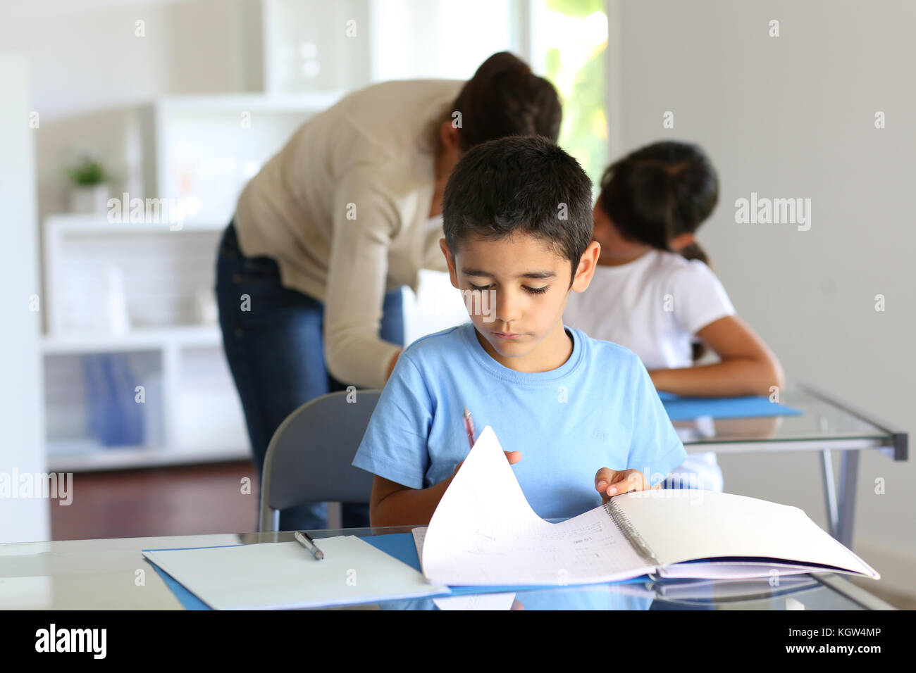 Children in class with teacher Stock Photo - Alamy