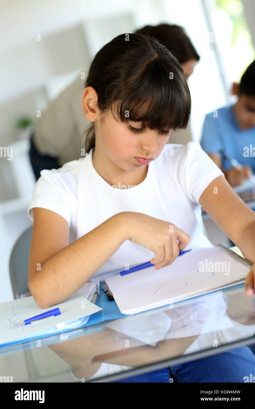 Young school girl with bored look on her face Stock Photo - Alamy