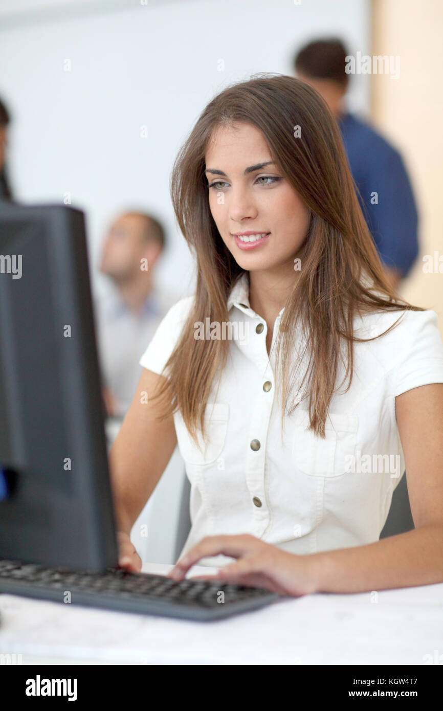 Portrait of student in front of desktop computer Stock Photo - Alamy