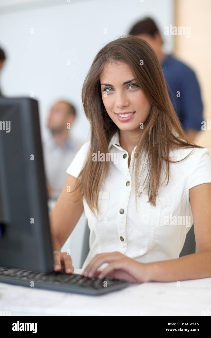 Portrait of student in front of desktop computer Stock Photo - Alamy