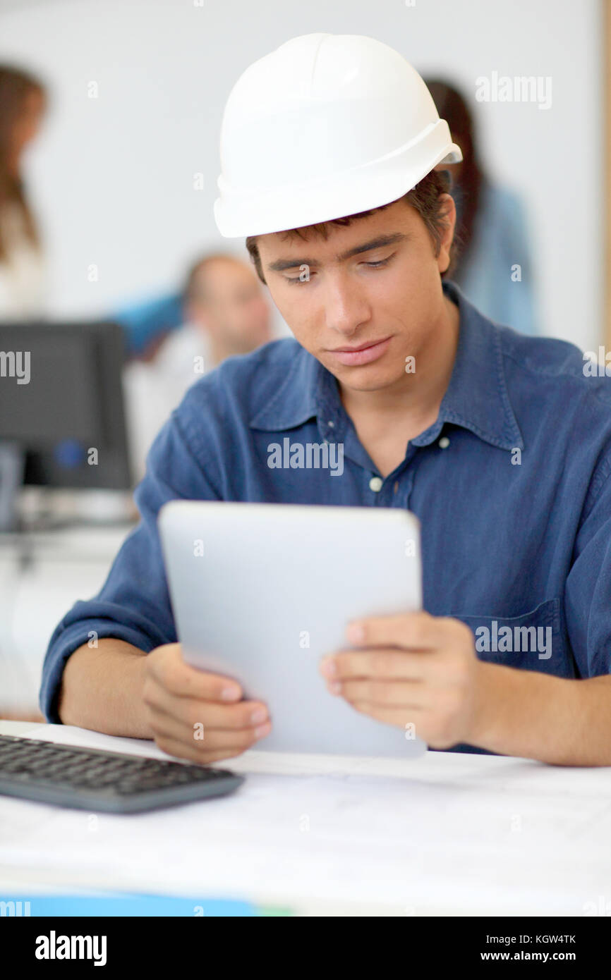 Student in architecture using electronic tablet Stock Photo - Alamy