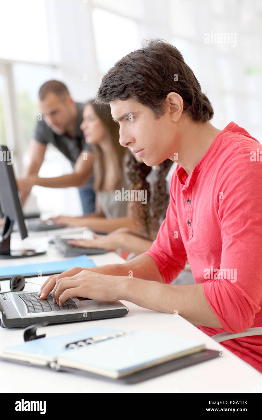 Student in class using laptop computer Stock Photo - Alamy