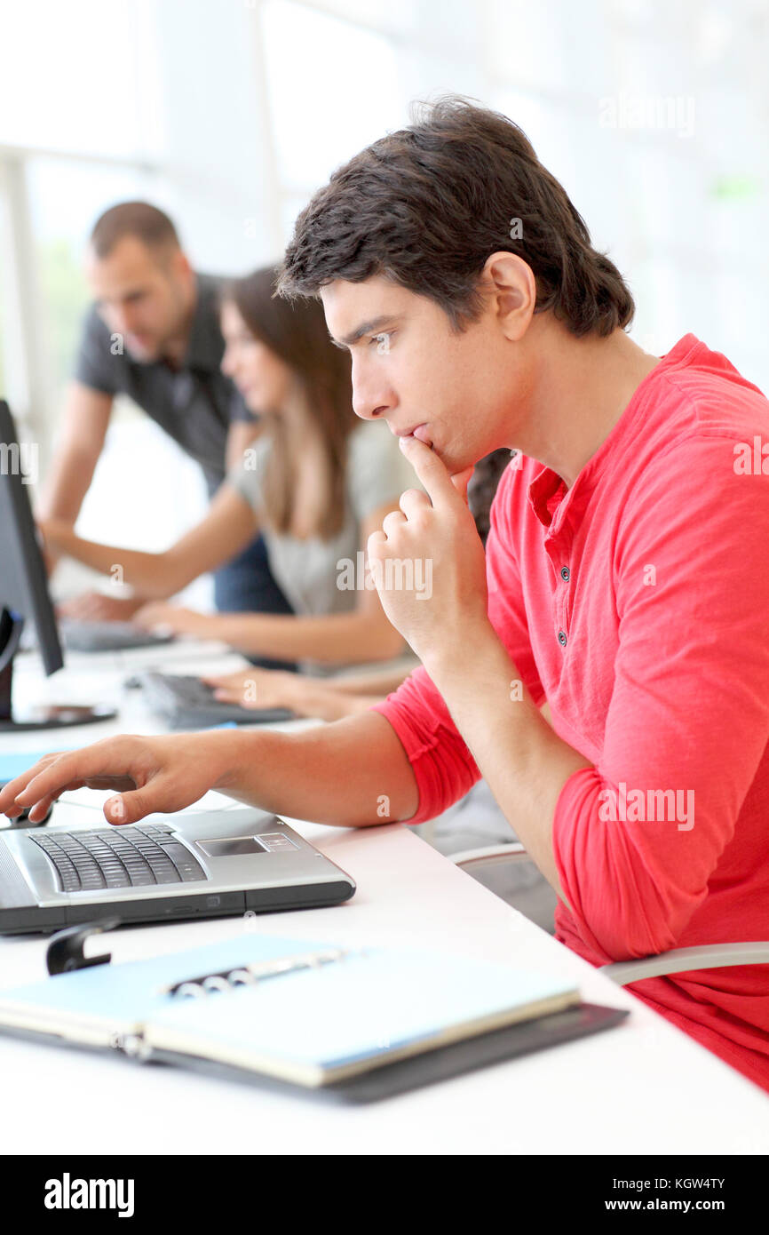 Student in class using laptop computer Stock Photo - Alamy