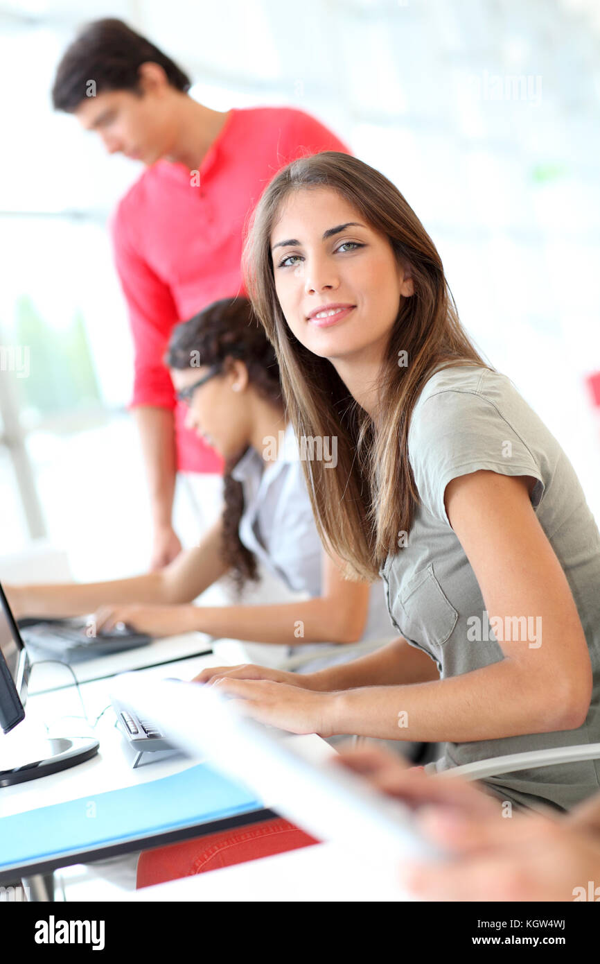 Portrait of student girl in computing class Stock Photo - Alamy