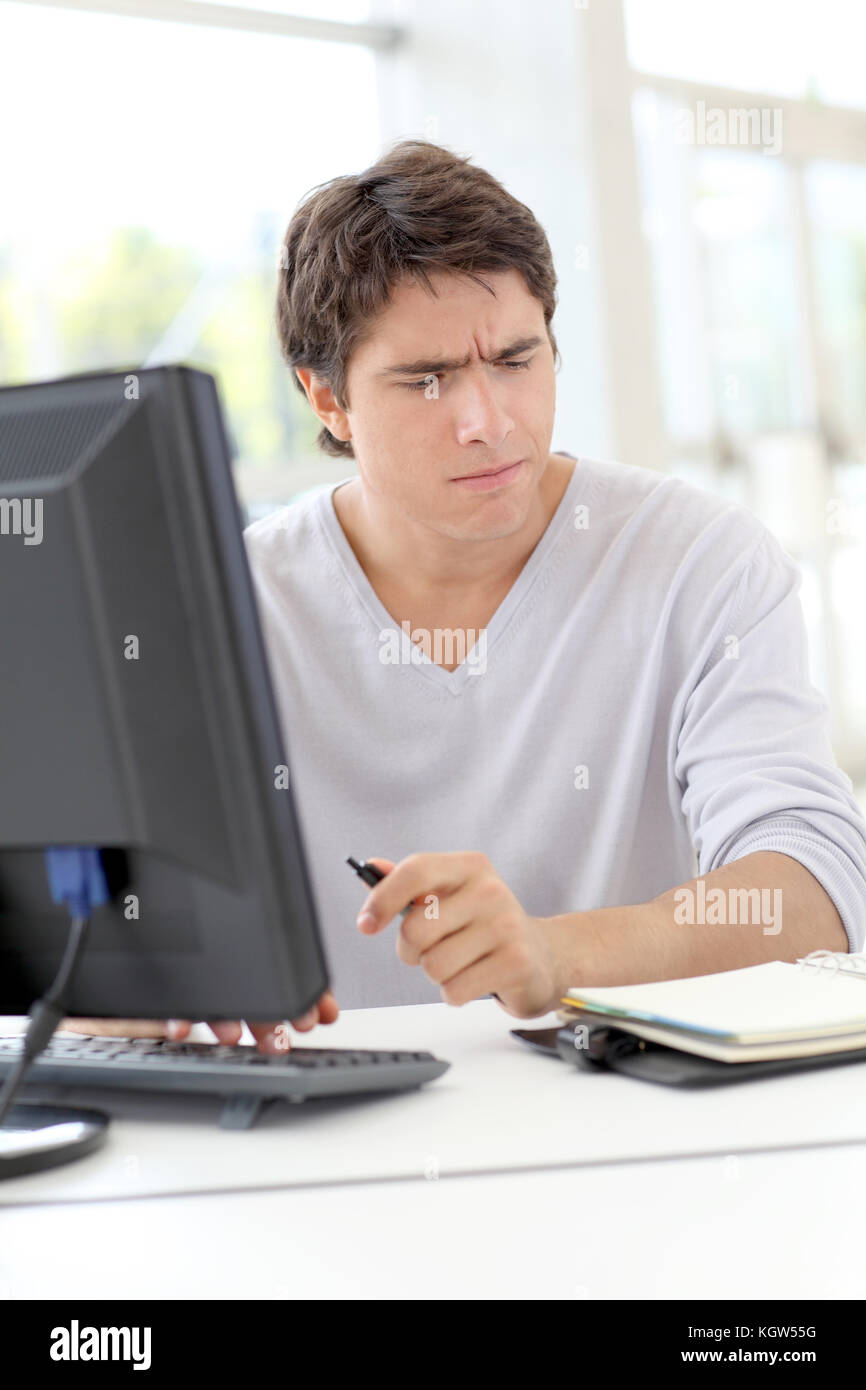 Office worker with thoughtful look Stock Photo - Alamy