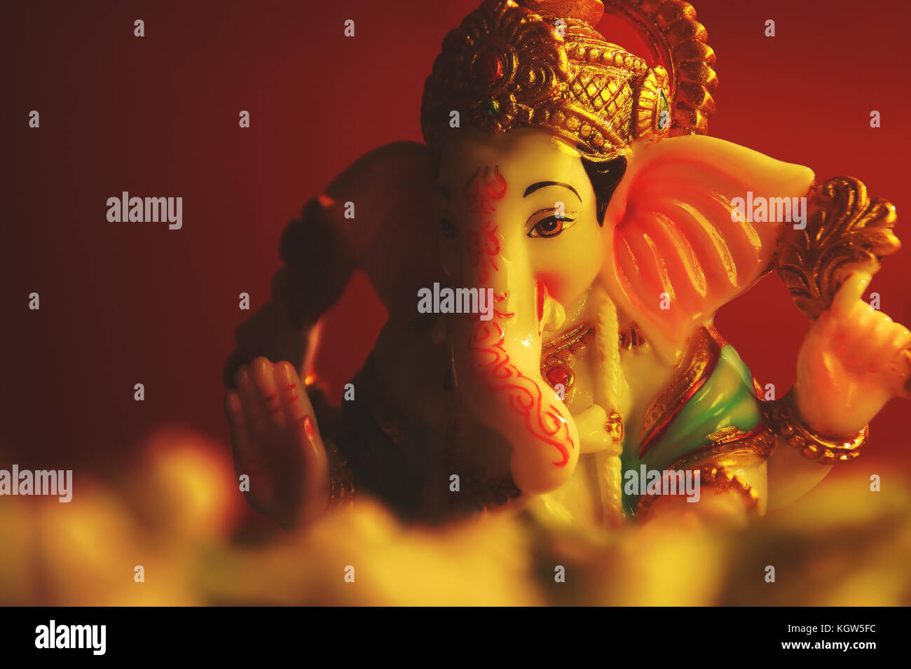 Hindu God Ganesha with jasmine flower Stock Photo - Alamy