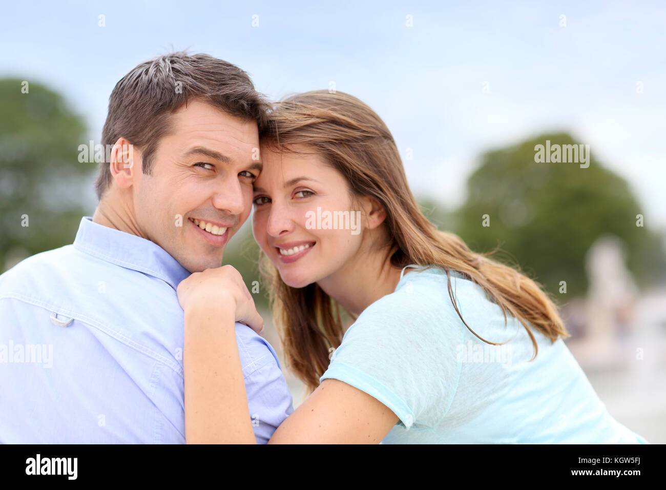 Couple of lovers in public park Stock Photo - Alamy