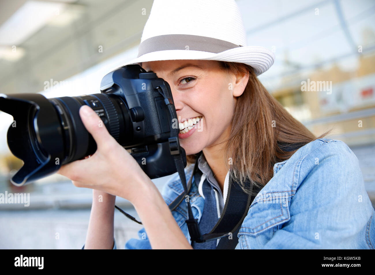 Photographer capturing photo with professional camera Stock Photo - Alamy