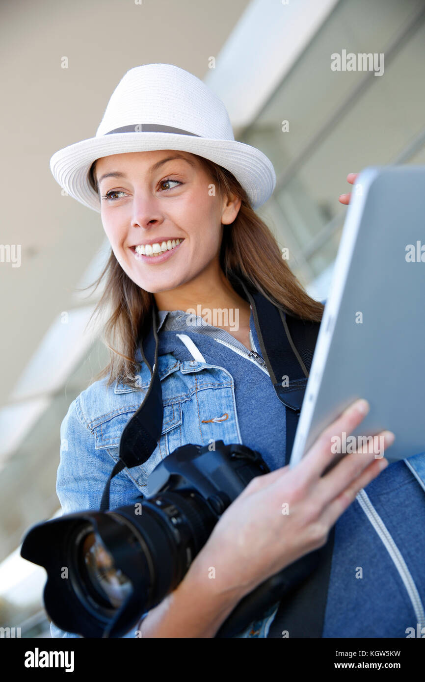 Smiling photographer using digital tablet Stock Photo - Alamy