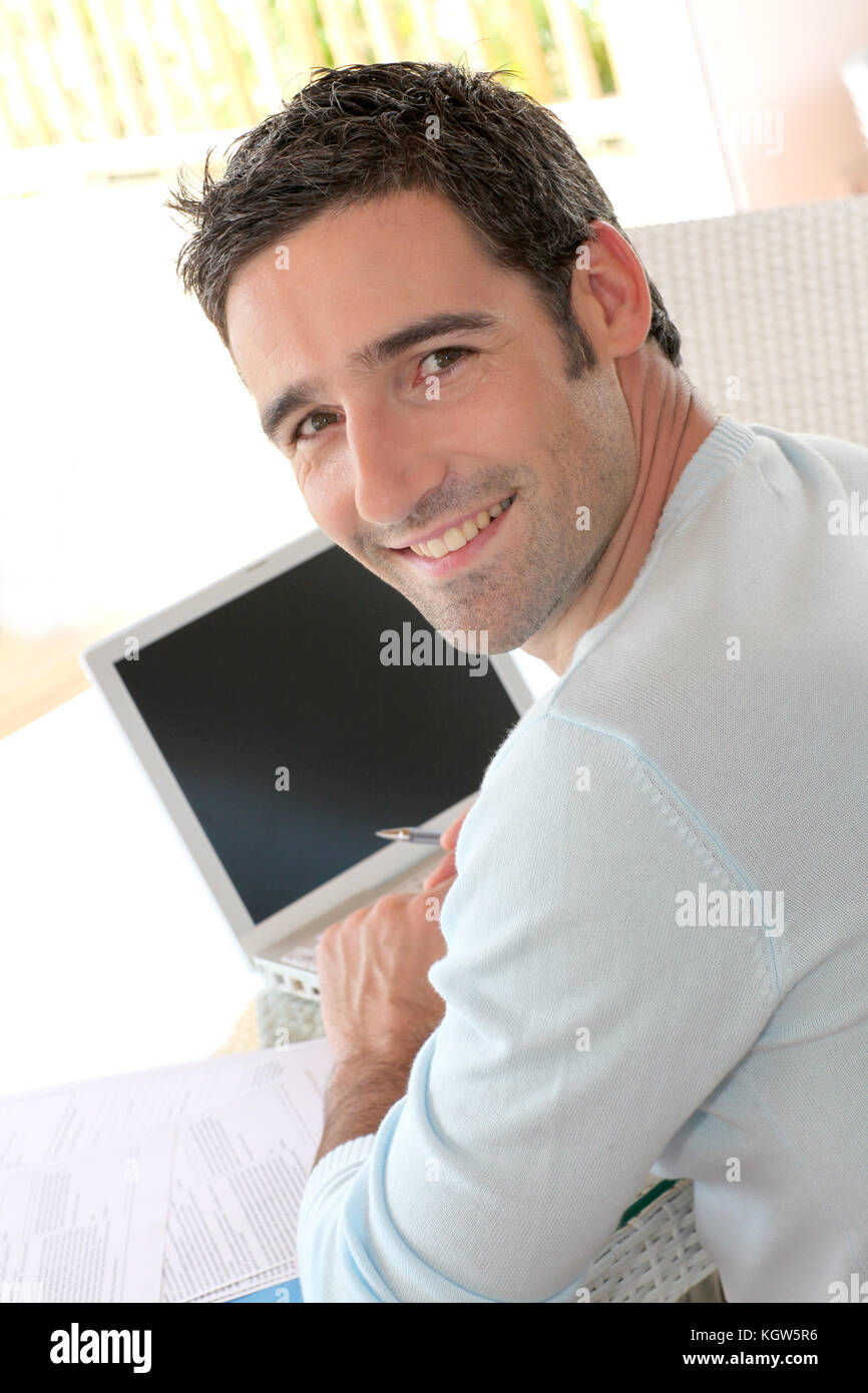 Portrait of smiling man working from home Stock Photo - Alamy