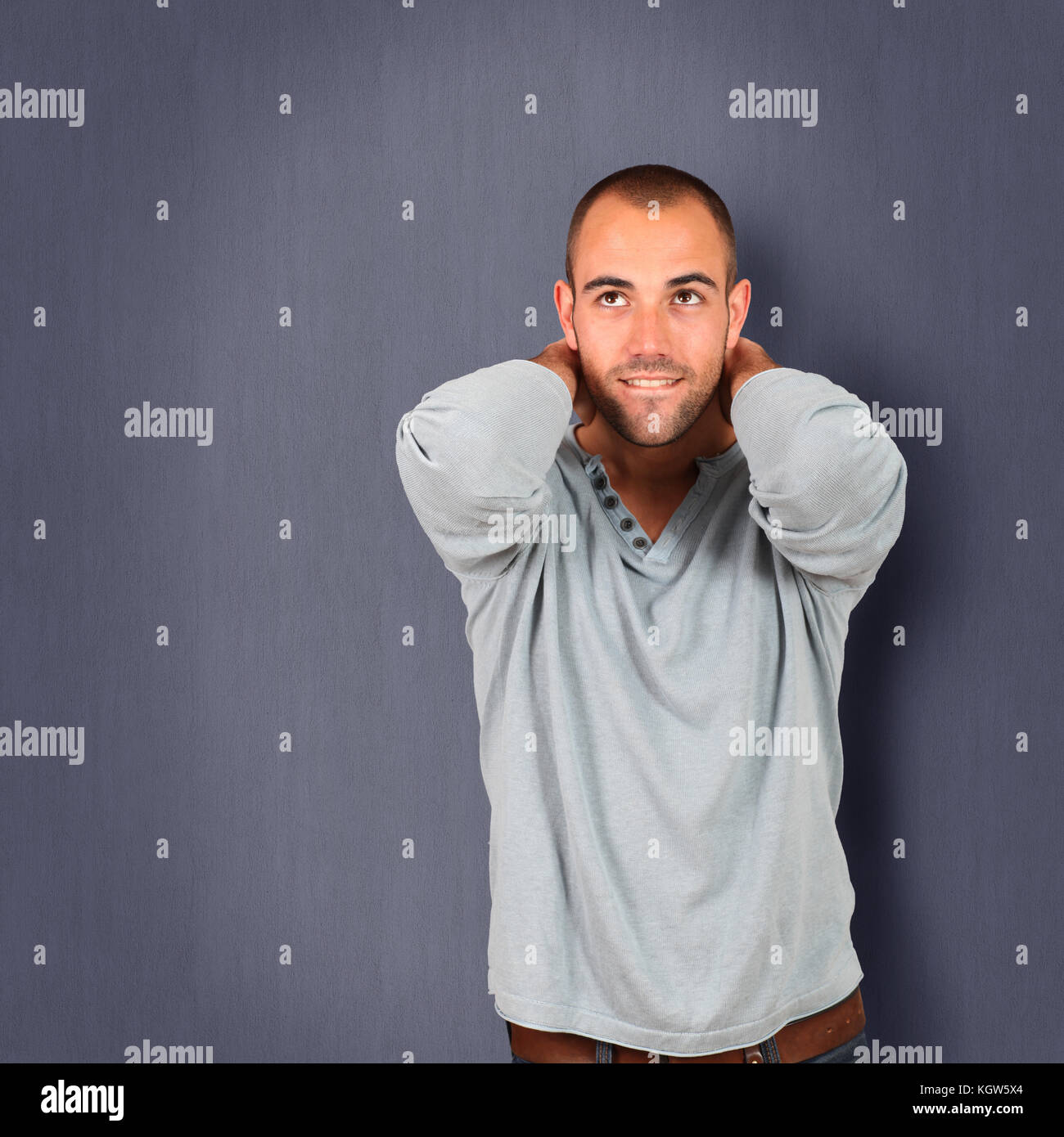 Handsome man standing on blue background Stock Photo - Alamy