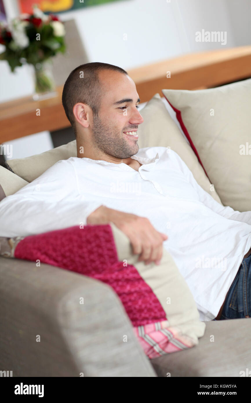Portrait of handsome man relaxing at home Stock Photo - Alamy