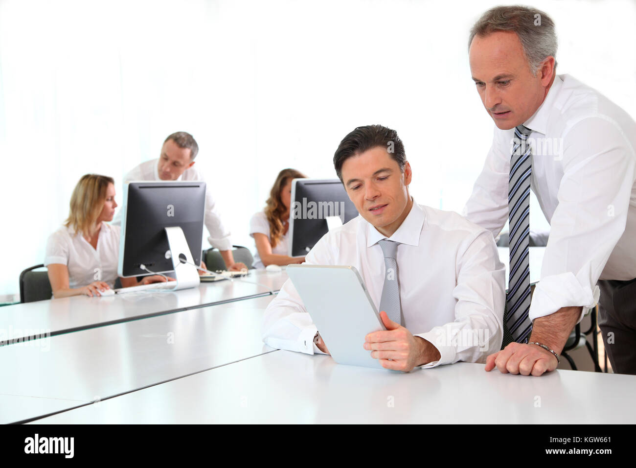Business team working in the office Stock Photo - Alamy