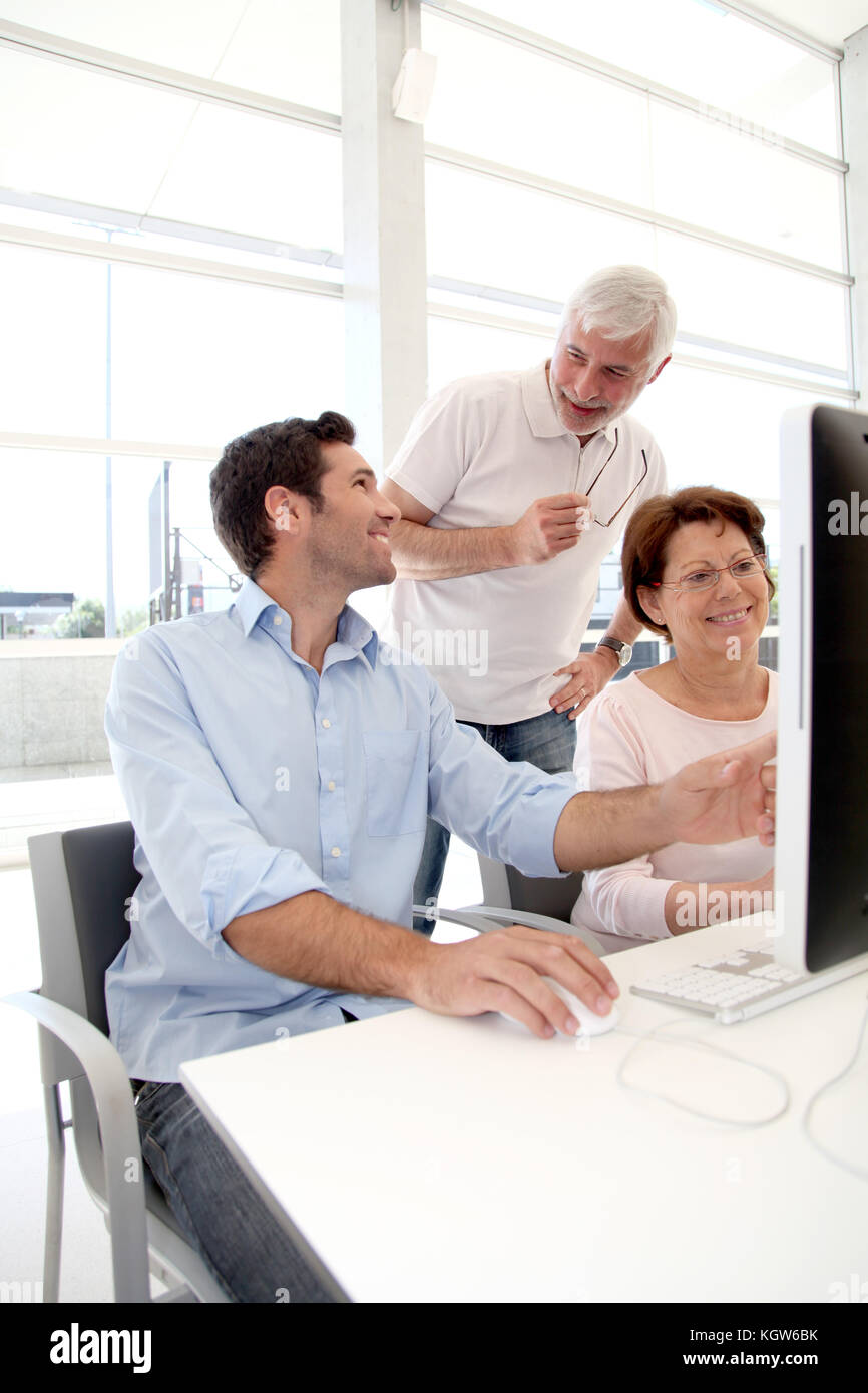 Senior people attending business training Stock Photo - Alamy