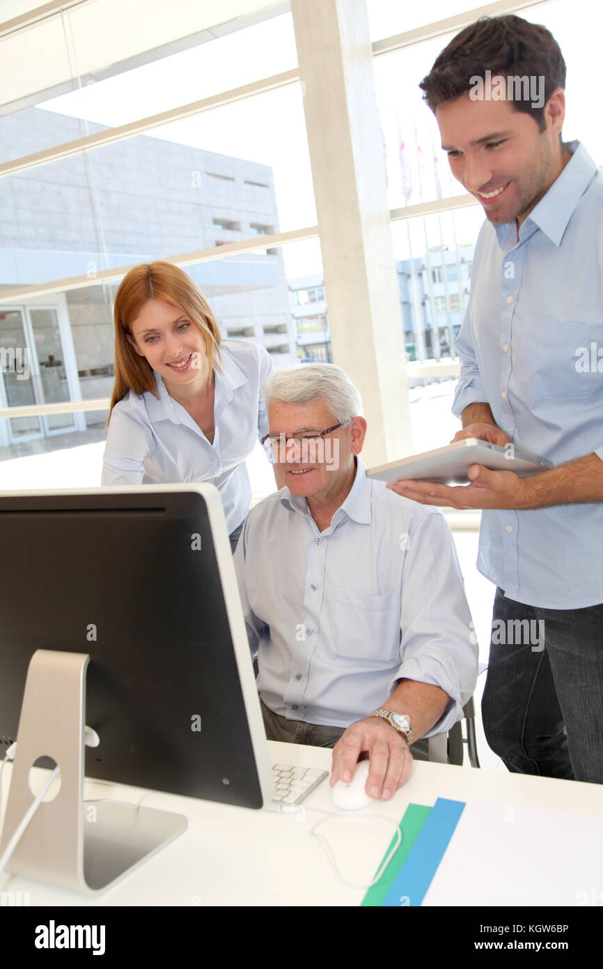 Senior people attending business training Stock Photo - Alamy