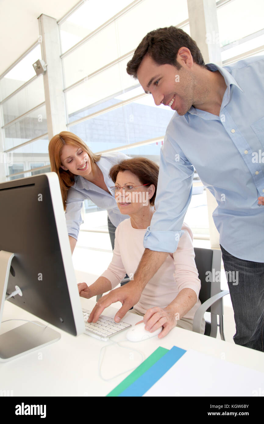 Senior people attending business training Stock Photo - Alamy