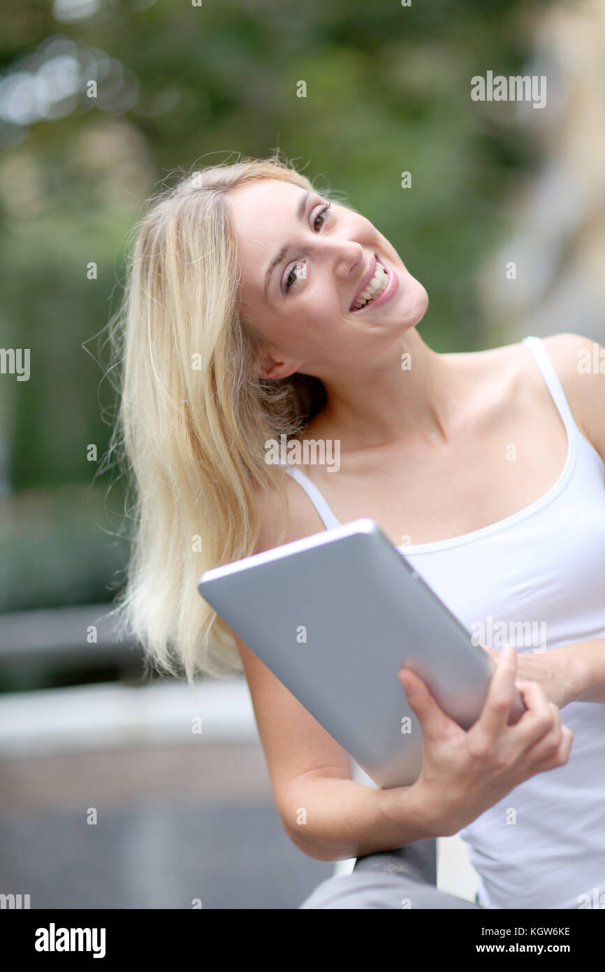 Beautiful woman with electronic tablet in town Stock Photo - Alamy