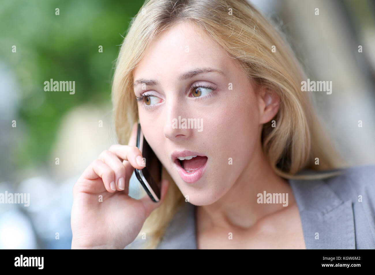 City girl talking on mobile phone in the street Stock Photo - Alamy