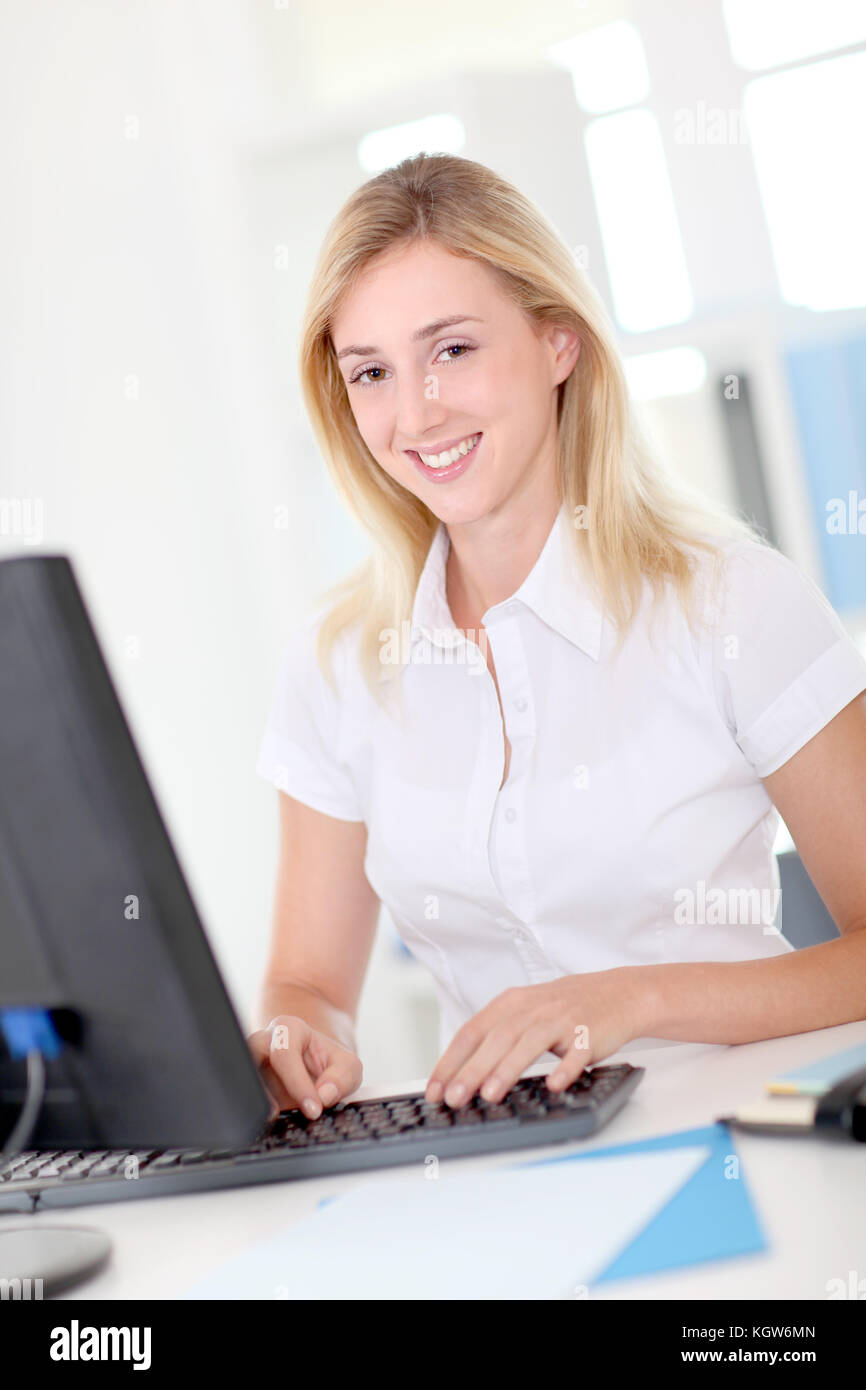 Office-worker sitting in front of desktop computer Stock Photo - Alamy