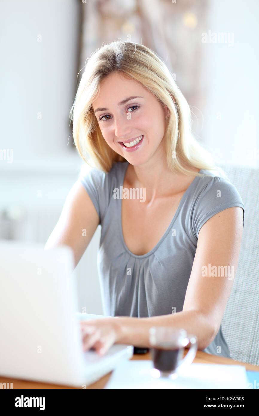 Woman working at home on laptop computer Stock Photo - Alamy